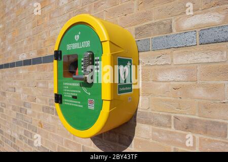 A defibrillator attached to the wall of a building Stock Photo - Alamy