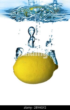 Fresh lemon dropped into water with bubbles isolated on white Stock Photo - Alamy