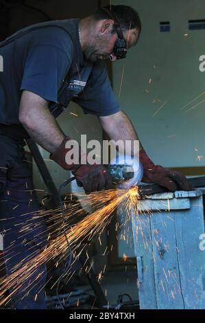 industry worker cut steel with spinning machine and spark Stock Photo ...