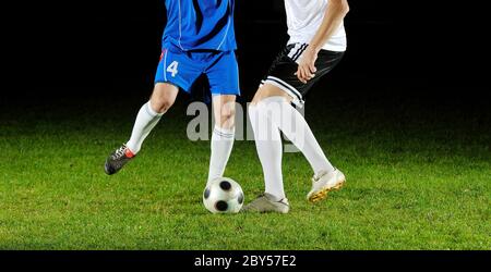 competition Action run and jump Duel of football players at soccer ball ...