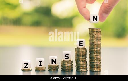 Dice form the German word 'Zinsen' (interest rates) on increasing high ...