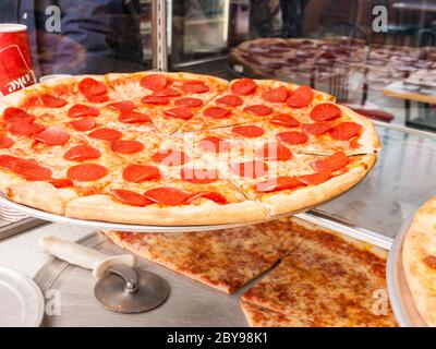 Pizza and pizza making Pizza on display at counter Stock Photo - Alamy