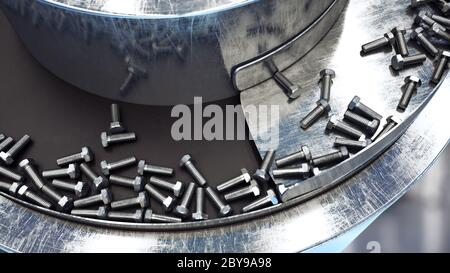 Process of production of bolts. Industrial concept. Factory equipment ...