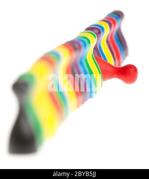 Colorful row of pawns, red fallen Stock Photo - Alamy