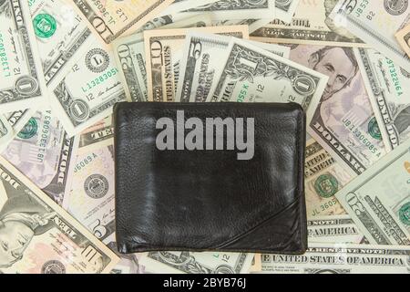 Old used wallet with dollars Stock Photo - Alamy