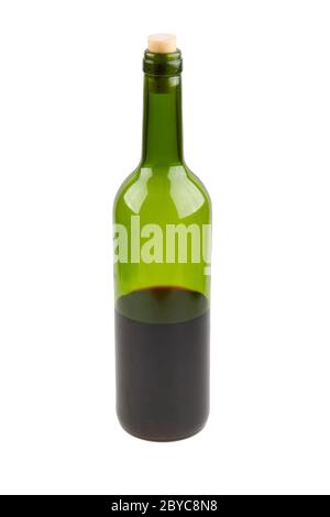Half empty red wine bottle isolated on white Stock Photo - Alamy