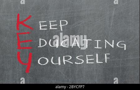 Chalk drawing - Keep educating yourself blackboard Stock Photo - Alamy