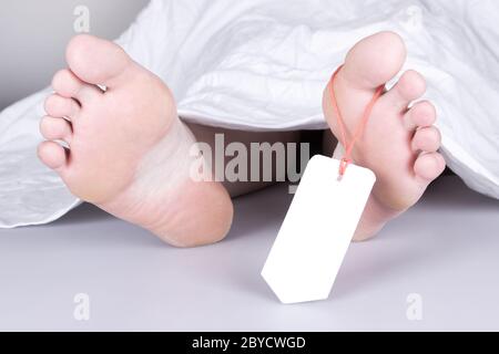 Dead body with toe tag Stock Photo - Alamy