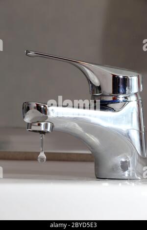 A dripping household tap Stock Photo - Alamy