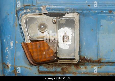 Broken taillight of a blue car close up Stock Photo - Alamy
