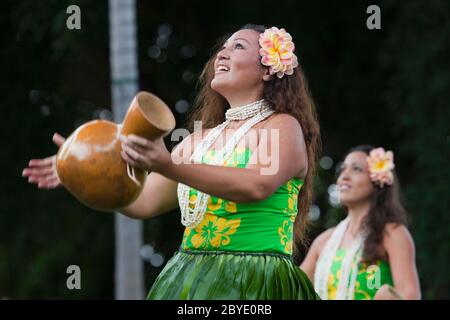 Hawaii, Kona, Traditional kahiko hula dancer with pu'ili (bamboo rattle ...