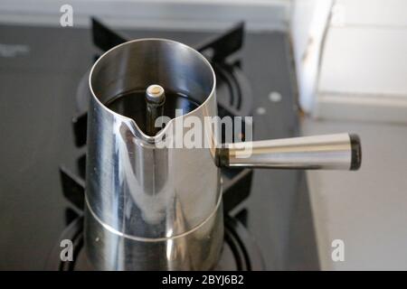Moka, typical italian cooking tool to make coffee, on cooking plate ...