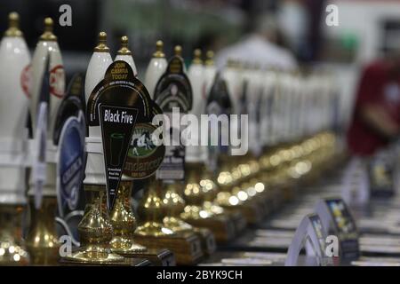 Traditional hand pumps for real ale on the bar of an English pub Stock ...
