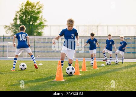 Boys Practicing Soccer on School Field. 10 Years Old Kids on Football ...