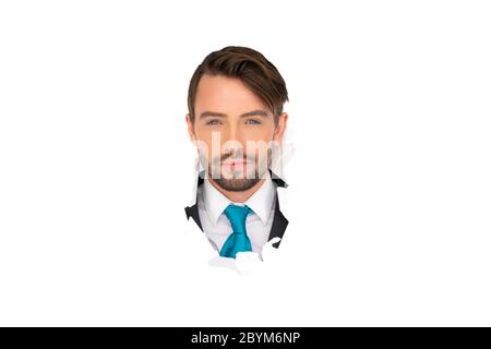 young businessman breaking through a white paper wall Stock Photo - Alamy