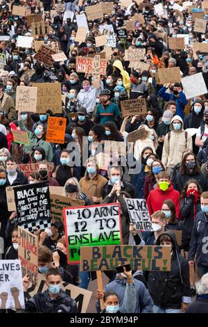 A crowd of protesters holding cardboard signs after Supreme Court ...