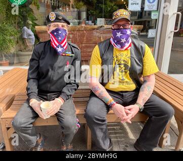 A veteran wearing a face mask due to the COVID 19 pandemic participates ...