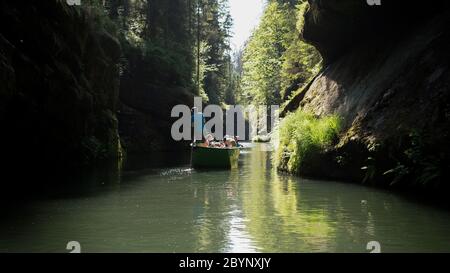 Touristic atraction on the river, people on the boat traveling around ...