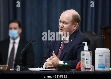 Senator Chris Coons, a Democrat from Delaware, right, and John Coons ...