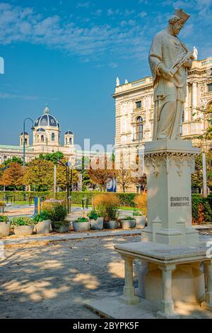 Statue of priest with figure of crucified Jesus in Vienna downtown at ...