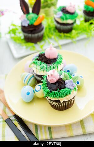 Easter chocolate cupcakes decorated with piggy and bunny ears Stock ...