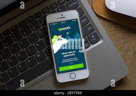 Upwork for Freelancers mobile app login page on a smartphone. Upwork is ...