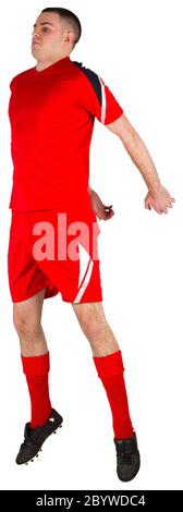 Fit football player jumping up on white background Stock Photo - Alamy