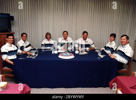 STS-83 Mission Specialist Donald A. Thomas is assisted into his launch ...
