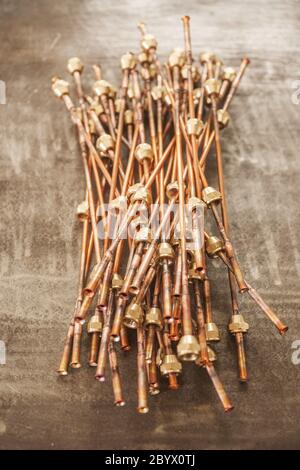 Plumbing copper water pipe fittings on wooden board Stock Photo - Alamy