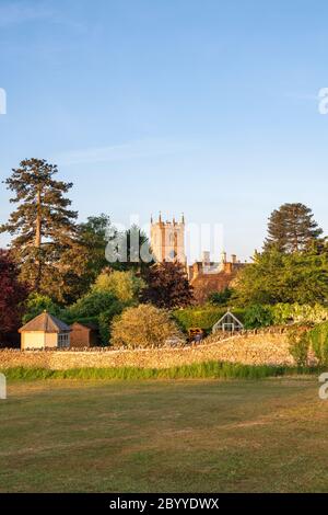 Combe village with St Laurence church tower in the early morning at ...