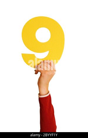 Number nine in hand isolated on black background. Number 9 in a child's ...