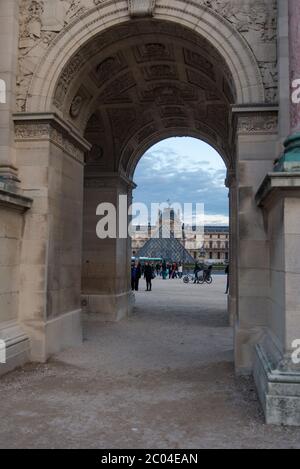 the louvre pyramid through the archway Stock Photo - Alamy