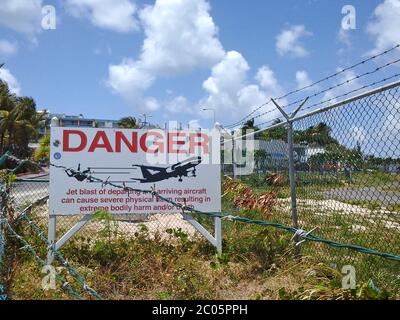 Sign at airport warning of jet blast from aircraft Stock Photo - Alamy