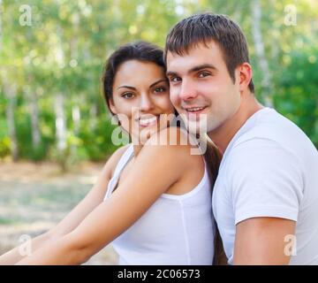 Portrait of a happy couple laughing at camera. Bridesmaid and groomsmen ...