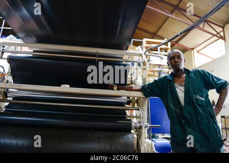 RWANDA, Kigali, plastic recycling at company Ecoplastics, machine Kabra ...