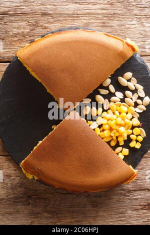 Close up of corn cake, peanuts, popcorn and pamonha on red tablecloth ...