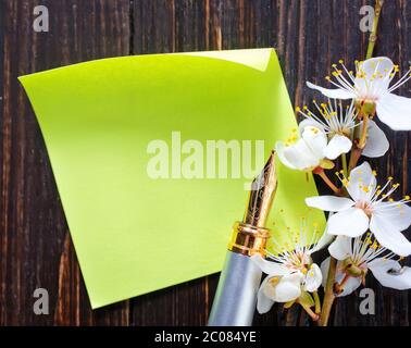 flowers and paper on wooden background Stock Photo - Alamy
