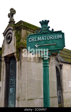 A direction sign in a cemetery, which gives the direction of a ...