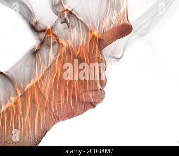 A human hand on fire burning with orange flames and some smoke in front ...