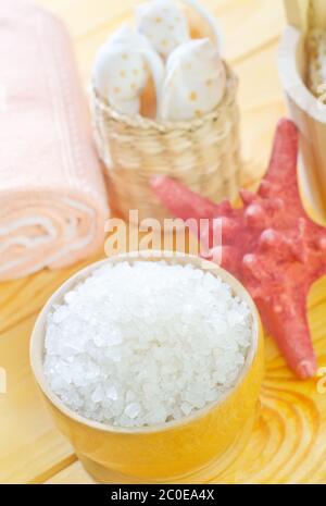 Peach bath salt and SPA products on rustic wooden background. Bathroom ...