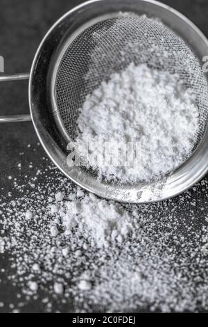 white sugar and table salt in clay bowls isolated on black background ...