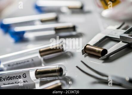 Expert Police measures bullet caliber in ballistic lab, conceptual ...