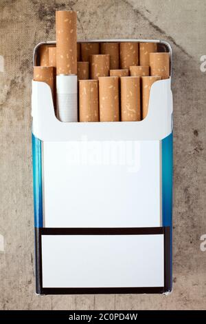 Pack of cigarettes with cigarettes sticking out Stock Photo - Alamy