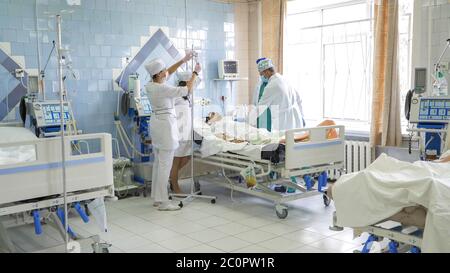 Seriously ill patient in hospital bed Stock Photo - Alamy