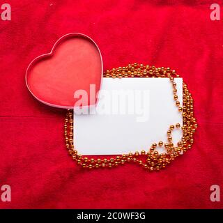 Red paper with message for Valentine's day and hearts on wooden table ...