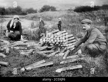 First World War artillery shells and poppies by the roadside near ...