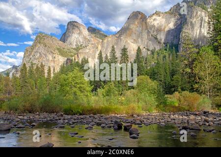 The Merced River in Yosemite Valley provides a serene landscape and ...