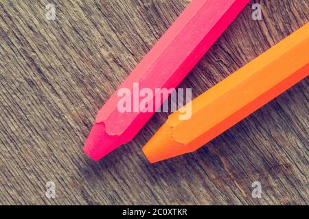 The color palette and two crayons Stock Photo - Alamy