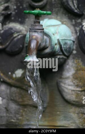 Water tap of a waterhole at the cemetery in Hameln Stock Photo - Alamy
