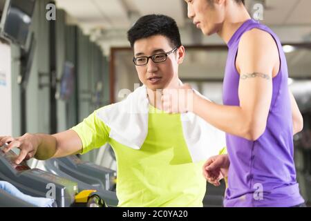 young asian men working out in modern gym Stock Photo - Alamy